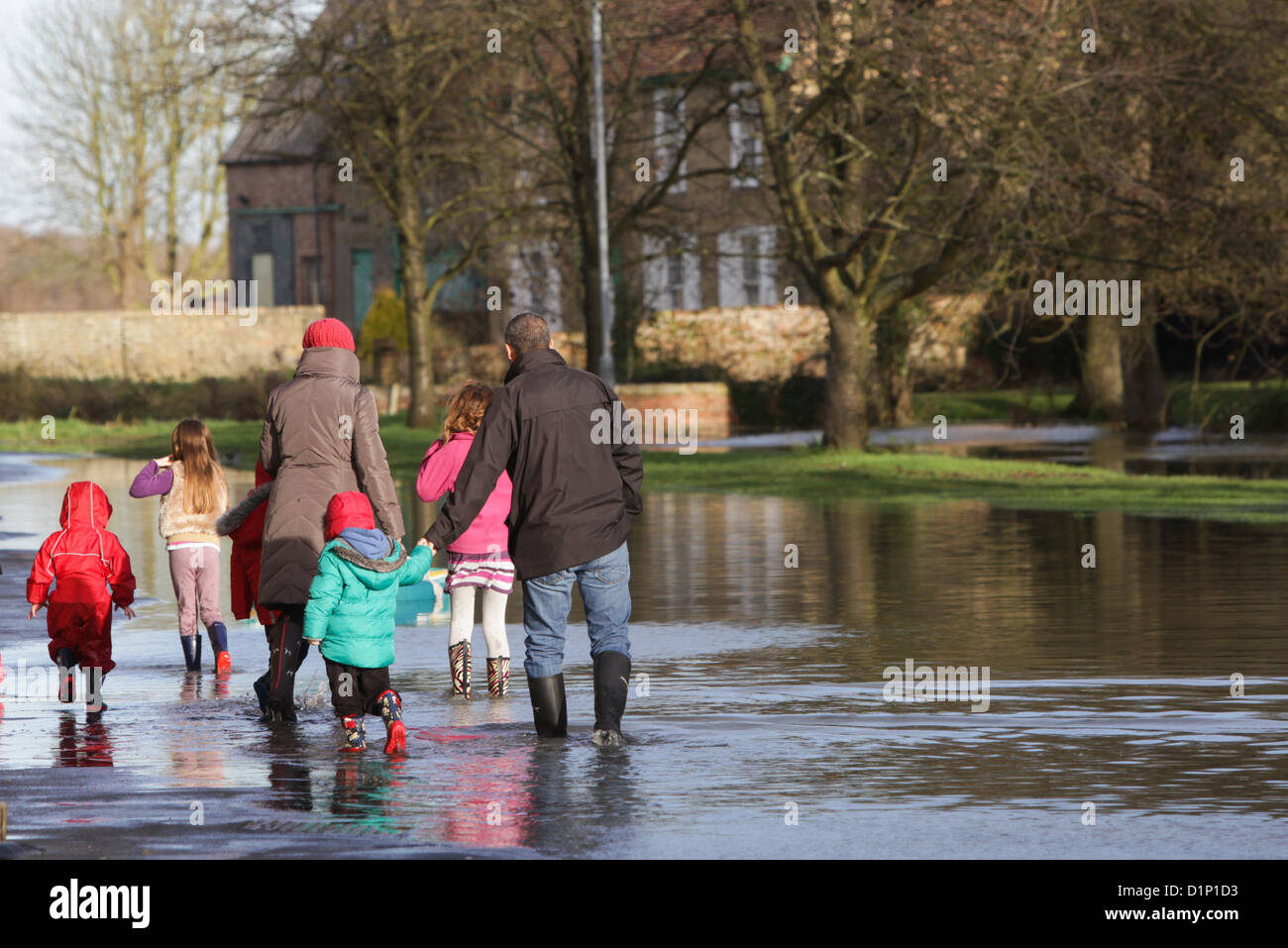 PEOPLE WALKING THROUGH FLOODED STREETS IN FEN DRAYTON,CAMBS AFTER HEAVY ...