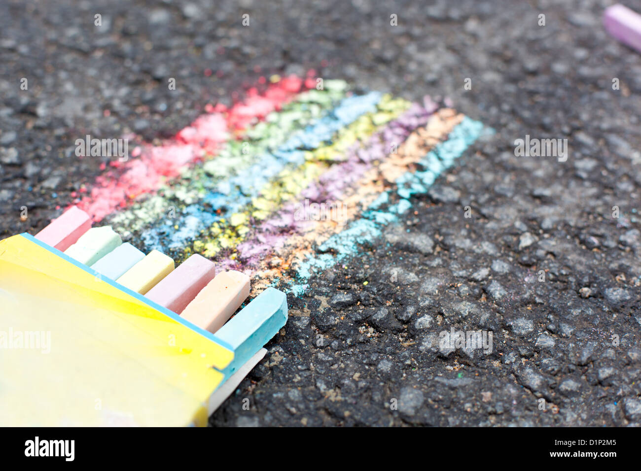 Set of colorful chalk lying on asphalt Stock Photo - Alamy