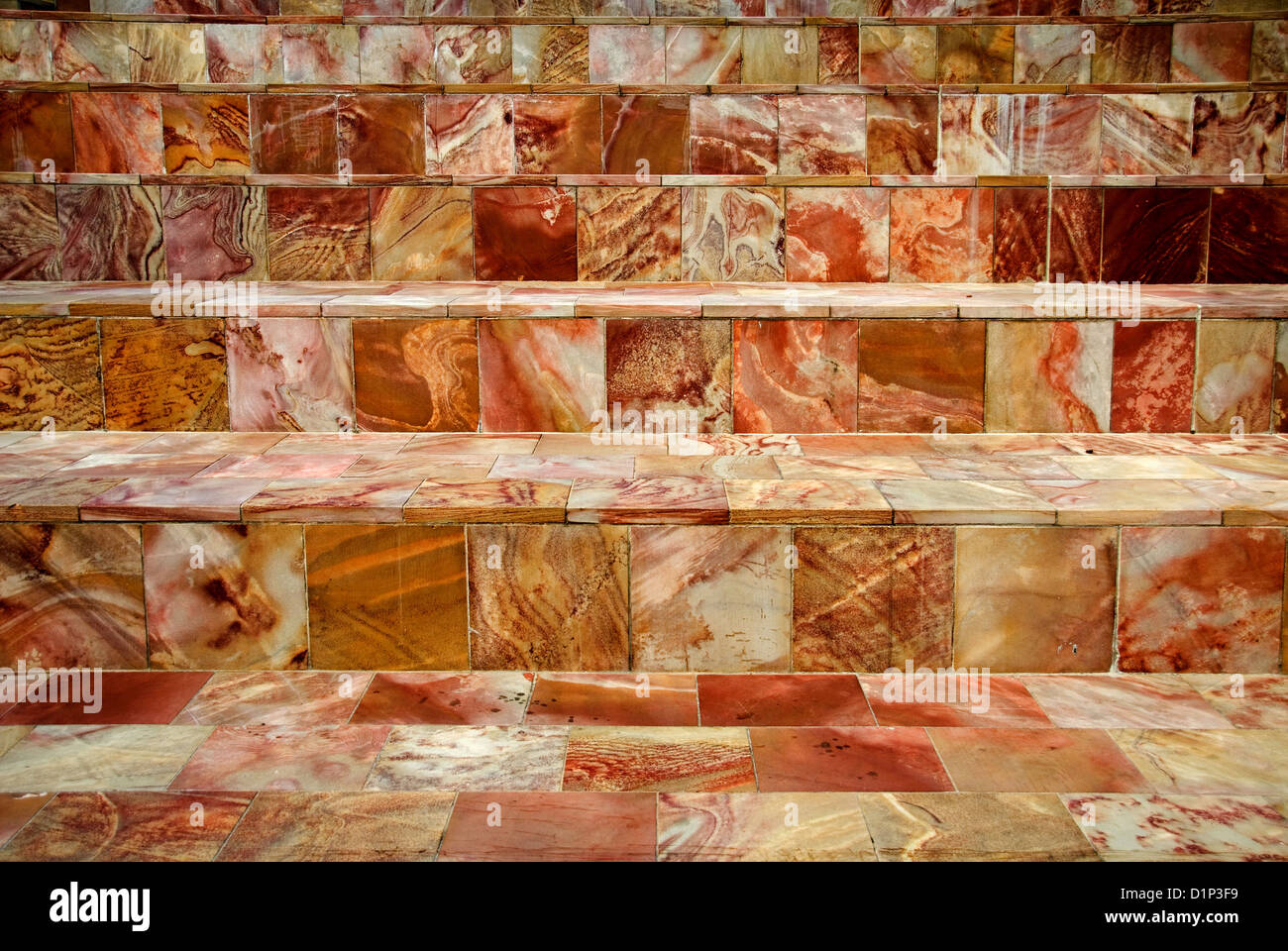 Multi-coloured carved stone stairs Stock Photo - Alamy
