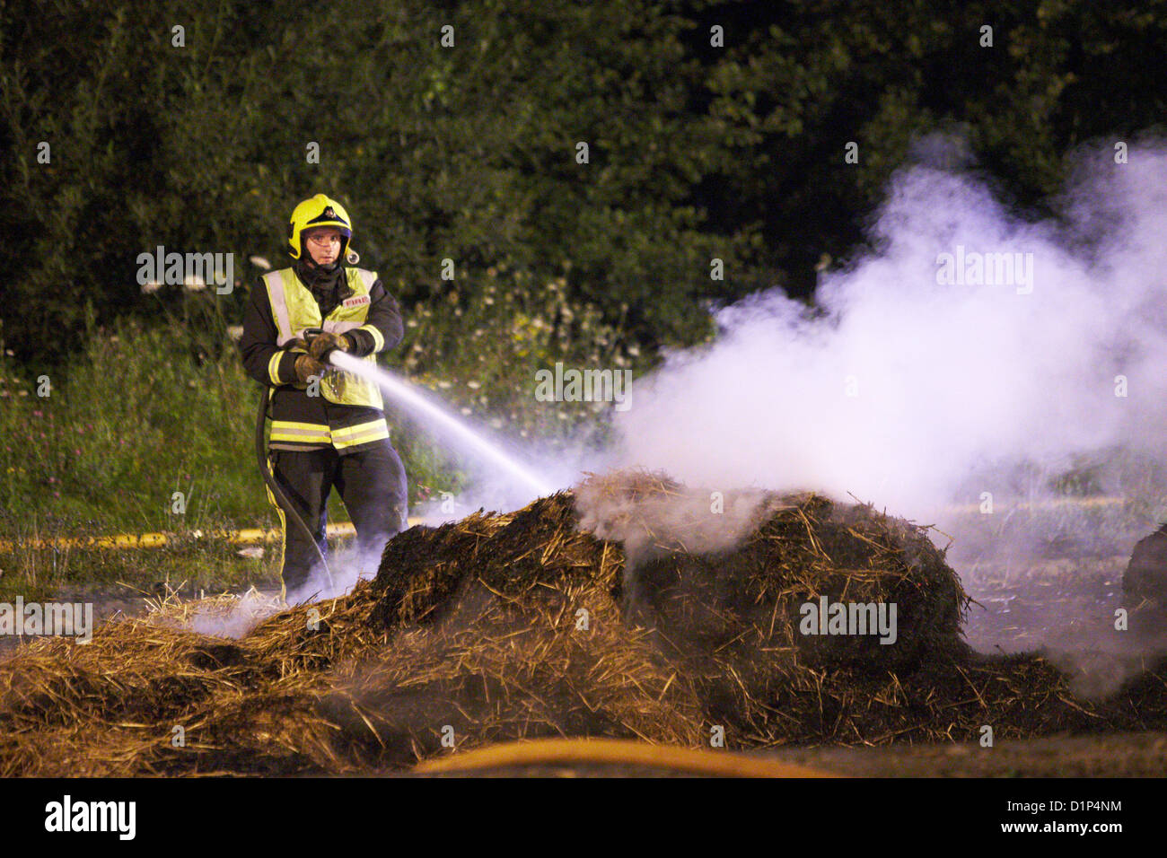 Fire fighters deal with a large hay lorry fire on the A41 near Aston ...