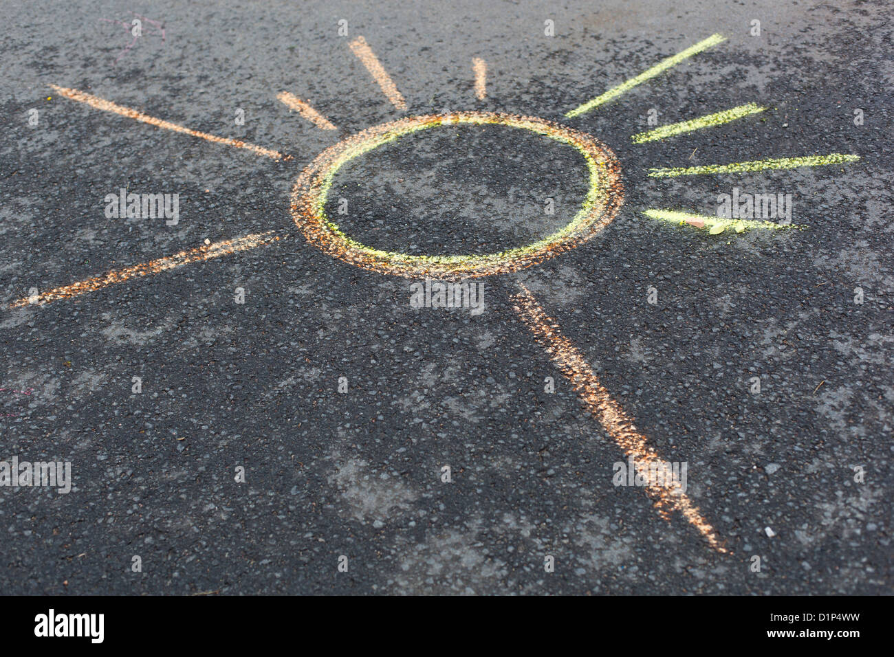 sun drawing on asphalt by chalks Stock Photo - Alamy