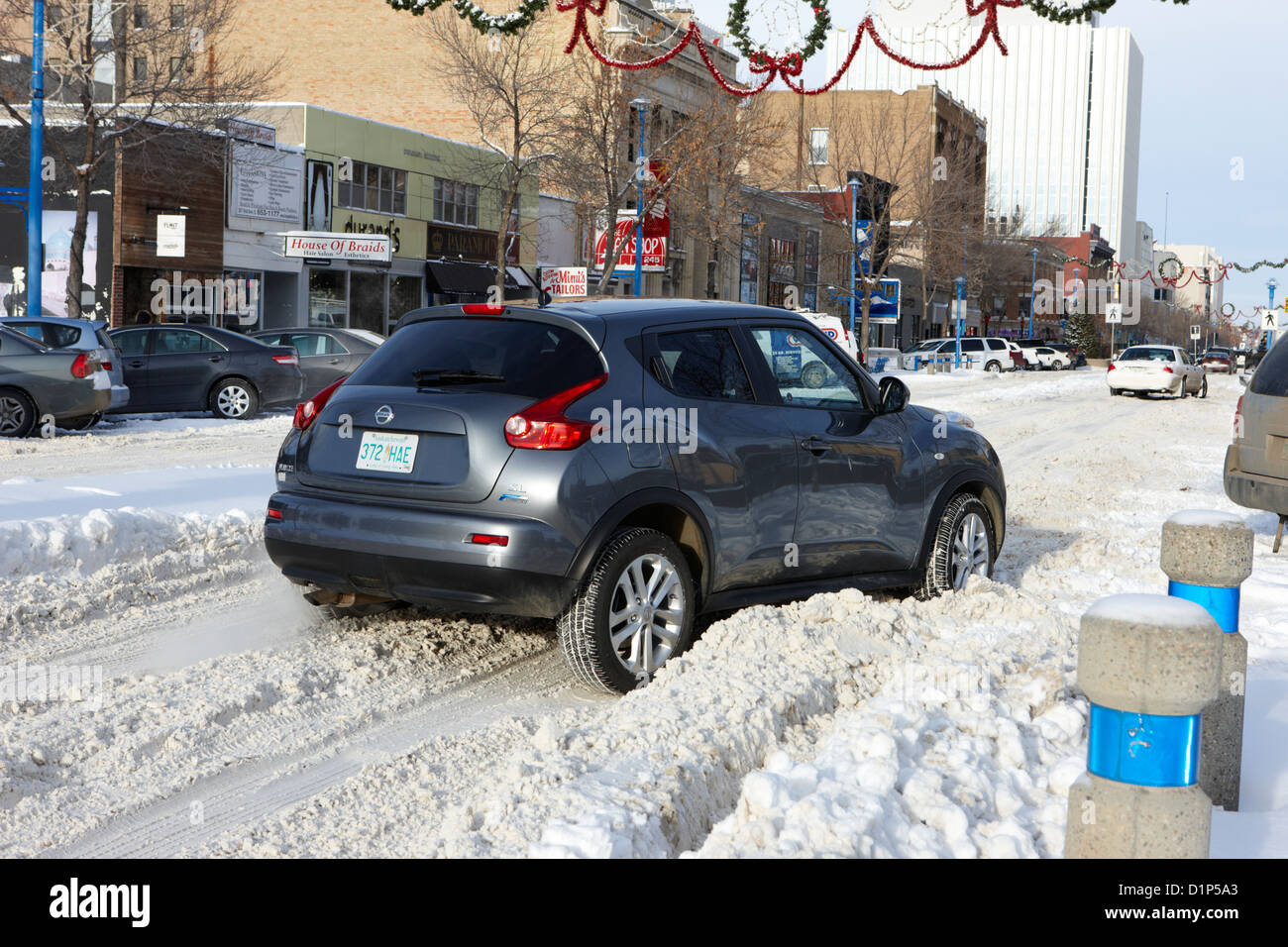car stuck in deep snow on downtown city street Saskatoon Saskatchewan ...