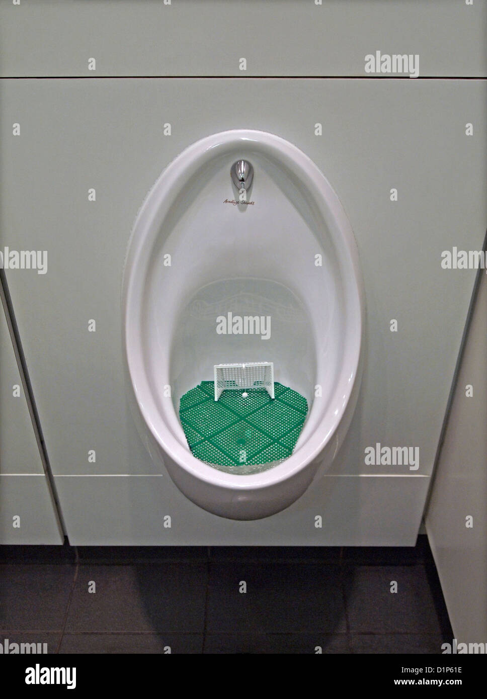 Amusing football-themed urinal Stock Photo - Alamy