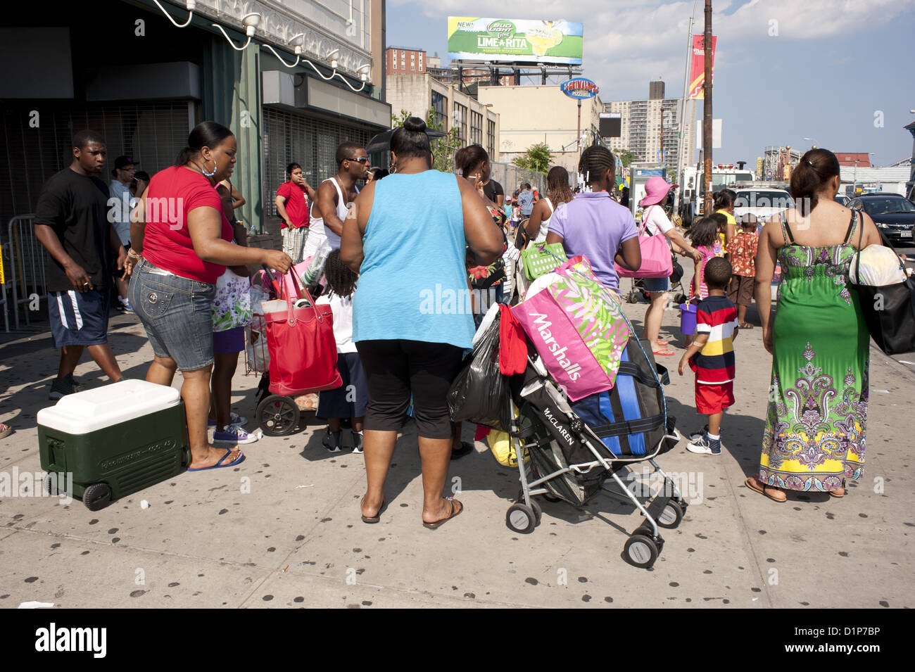 Fourth of July at Coney Island in Brooklyn, NY. Crowd arrives by subway ...