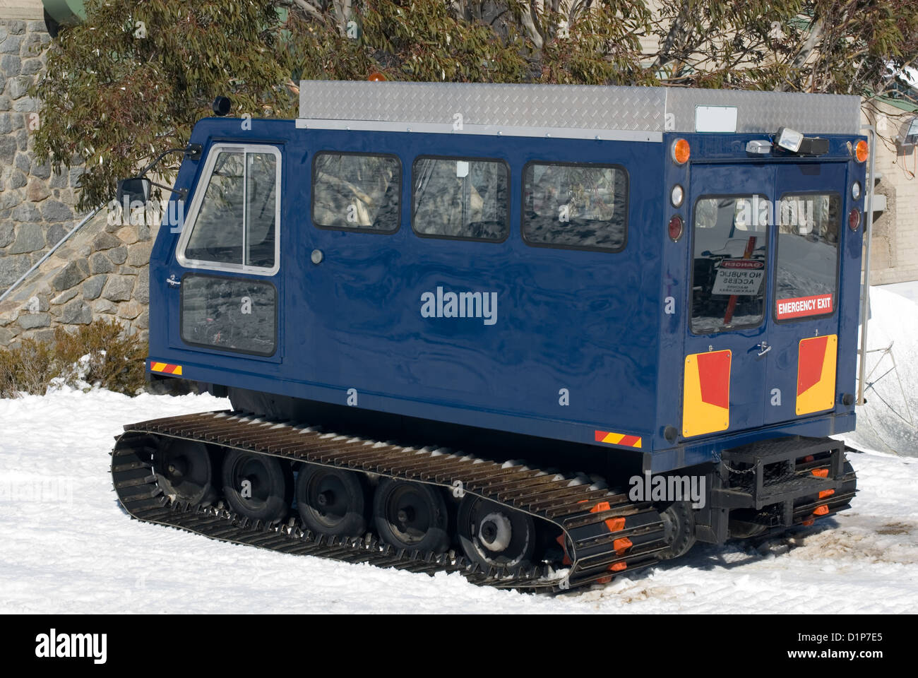 A snow transport vehicle parked outside a chalet at a resort in the ...