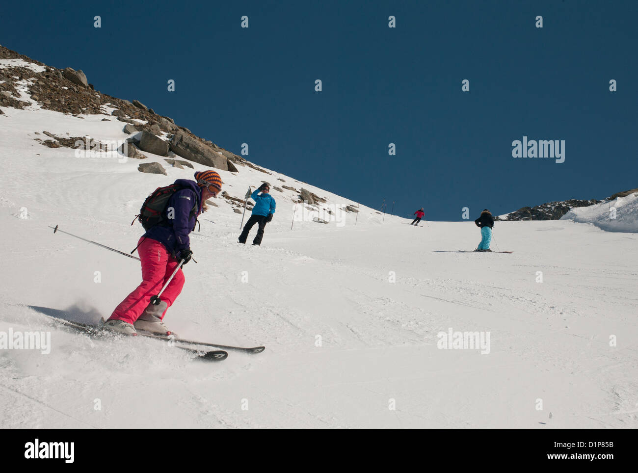 Skiers in action at Les Grands Montets ski area, Mont Blanc, Chamonix ...