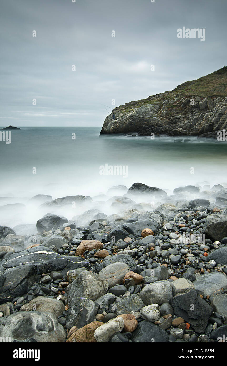 Cold Atlantic seascape with silky water and stones Stock Photo - Alamy