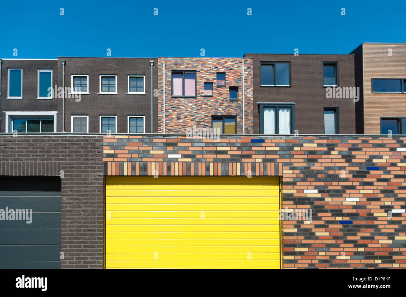 back view of newly build modern new houses in the Netherlands with a ...