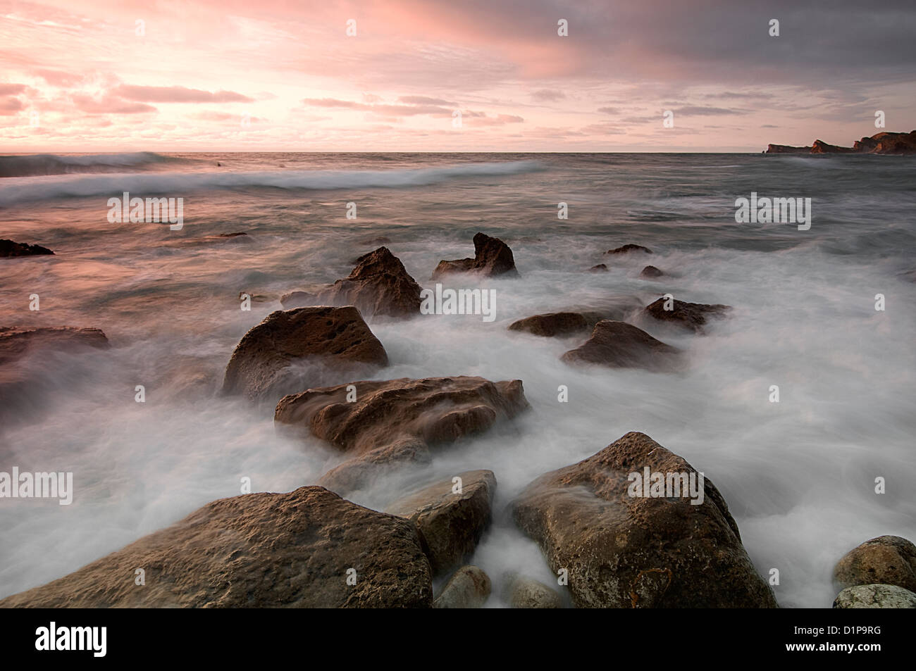 Atlantic seascape with silky water and stones Stock Photo - Alamy