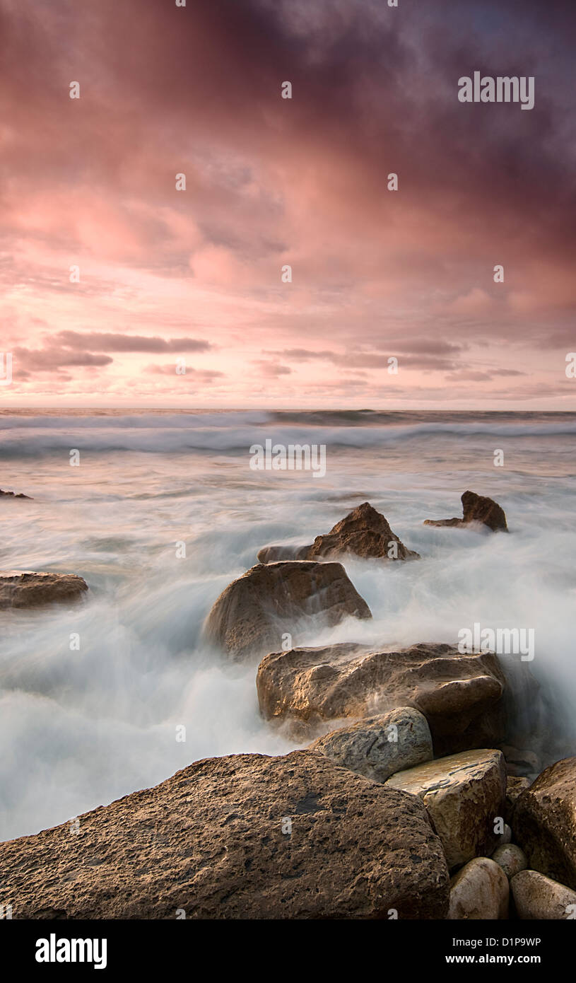 Atlantic seascape with silky water and stones Stock Photo - Alamy