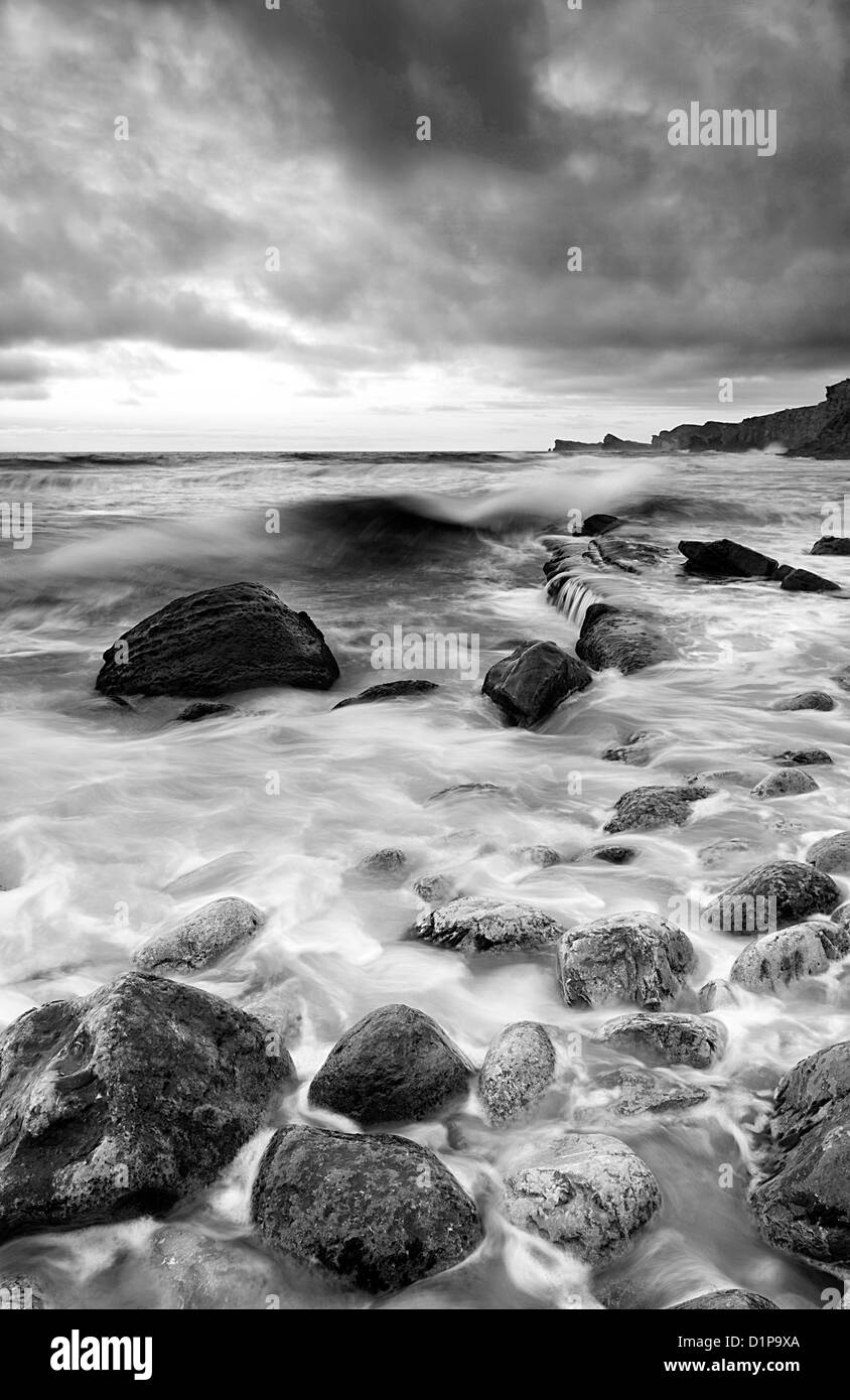 Atlantic seascape with silky water and stones Stock Photo - Alamy