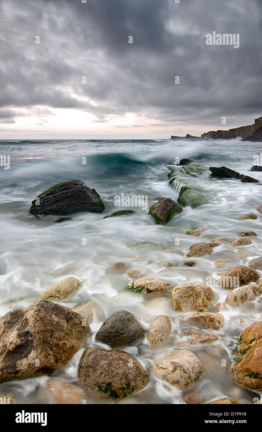 Atlantic seascape with silky water and stones Stock Photo - Alamy