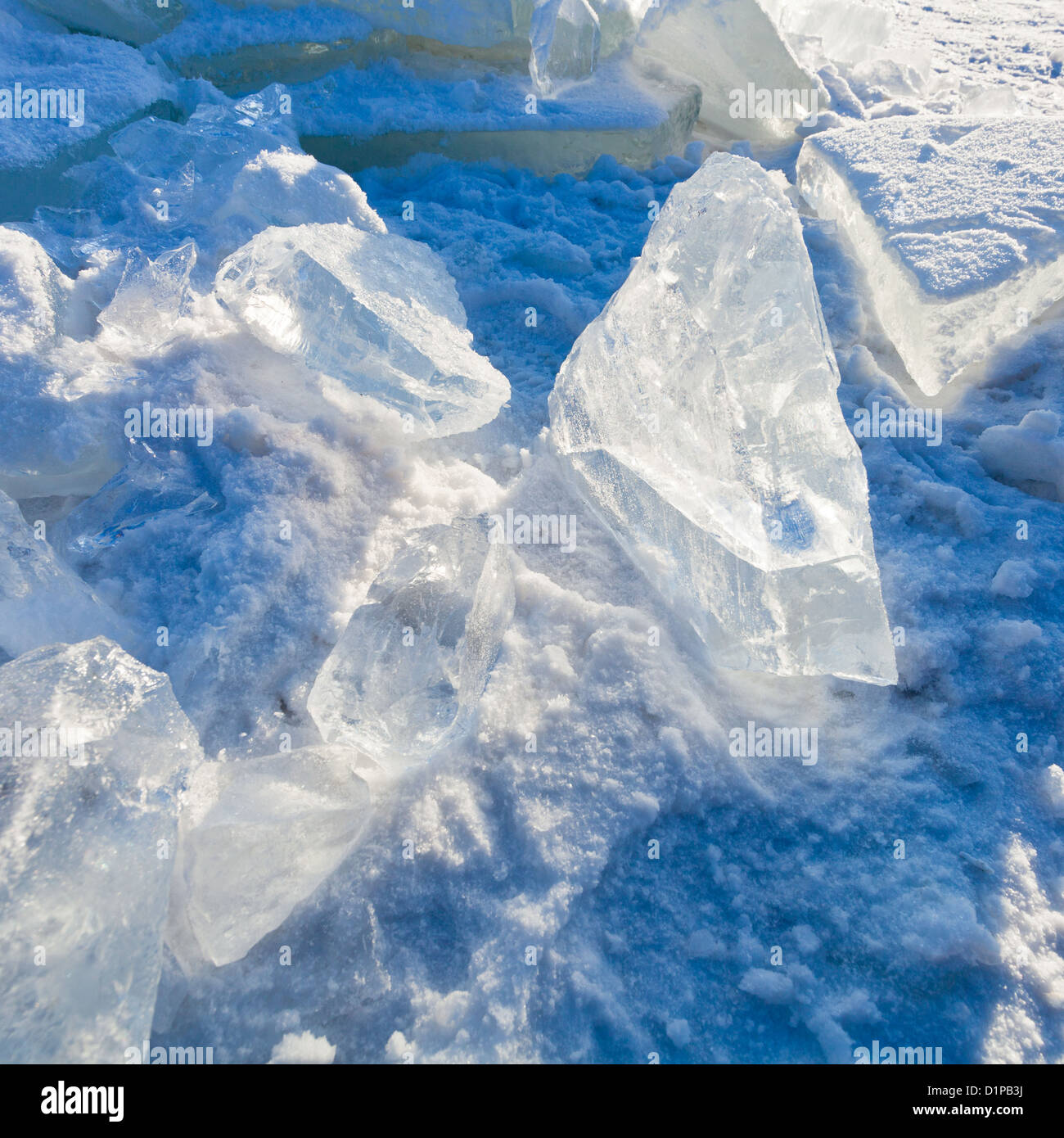 block of clear river ice in cold winter day under sunbeams in Moscow ...