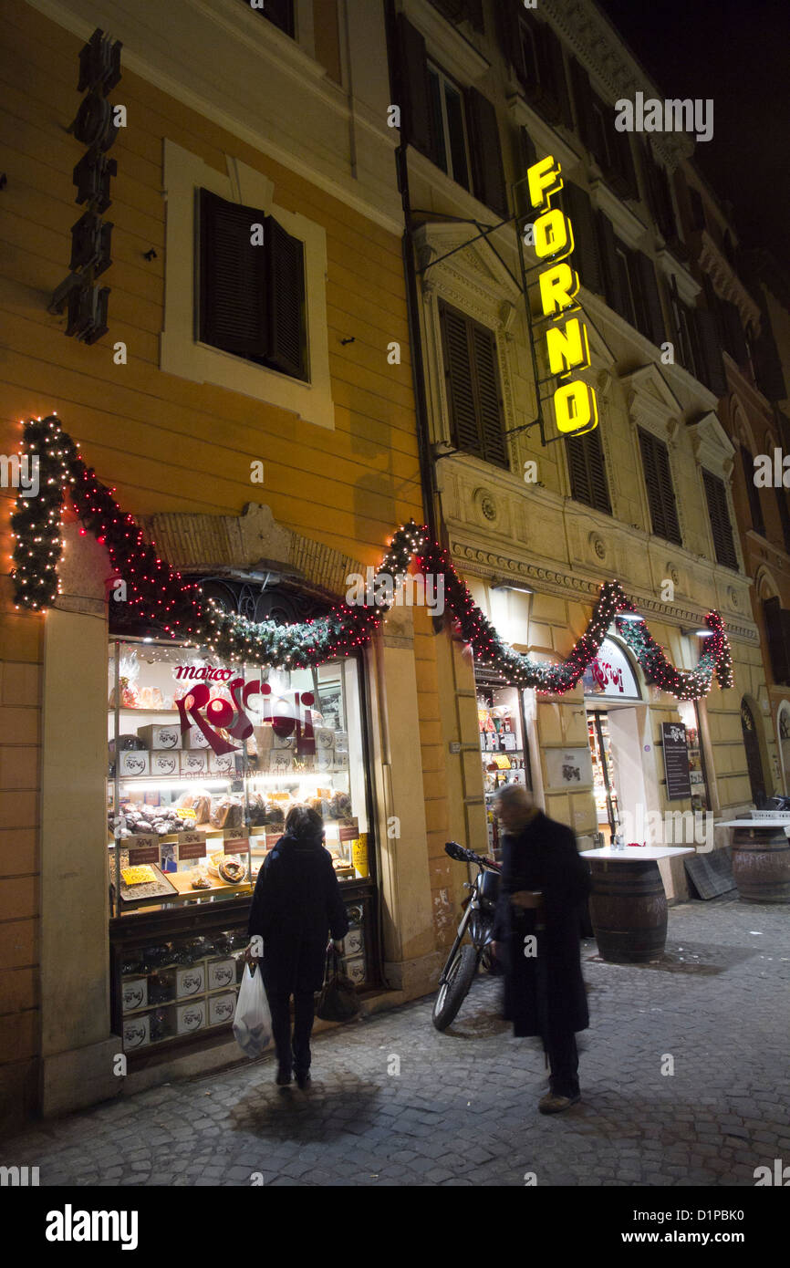 Rome bakery store in alley at night Italy Stock Photo - Alamy