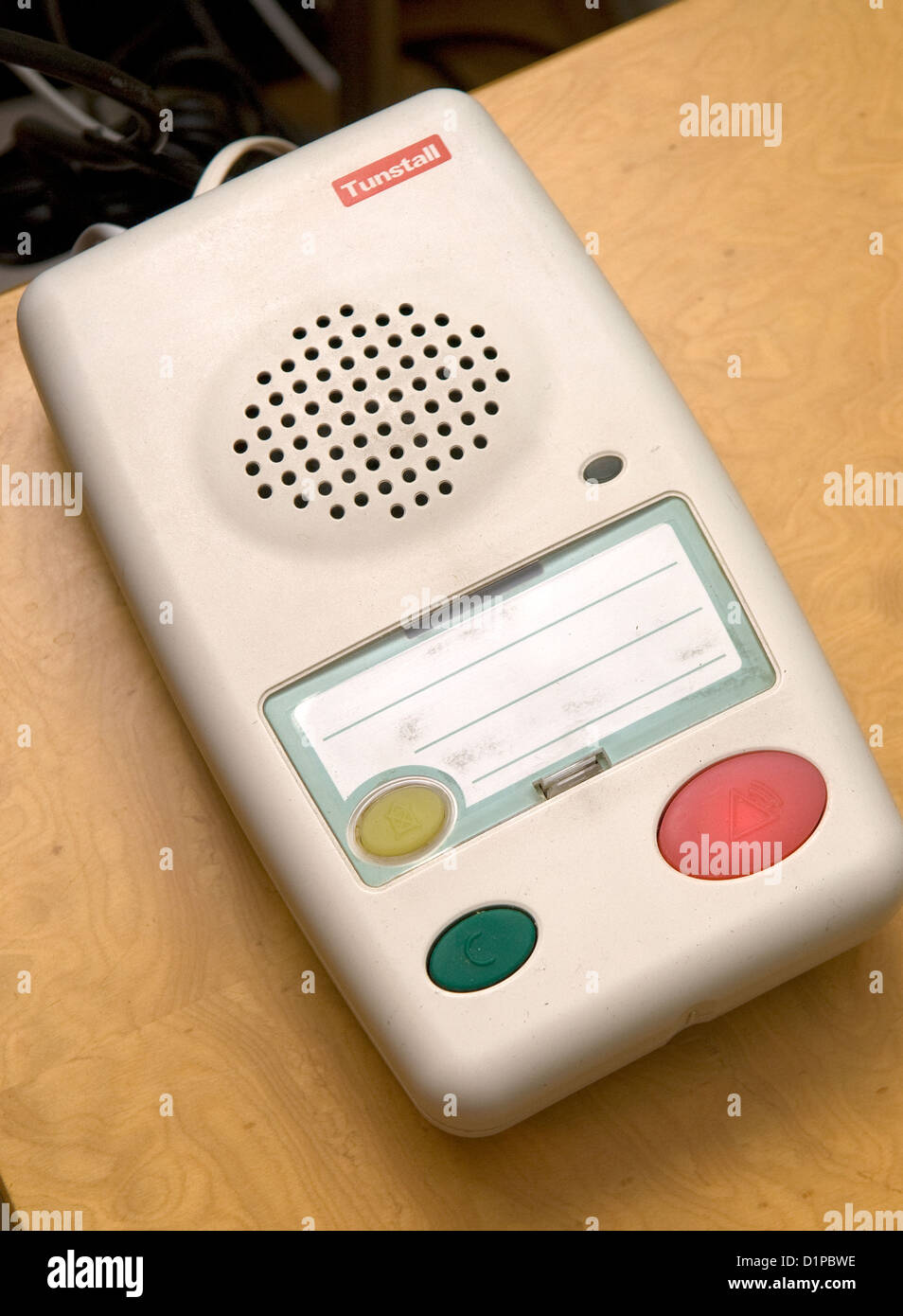 Telecare control device for alerting call centre to an emergency ...