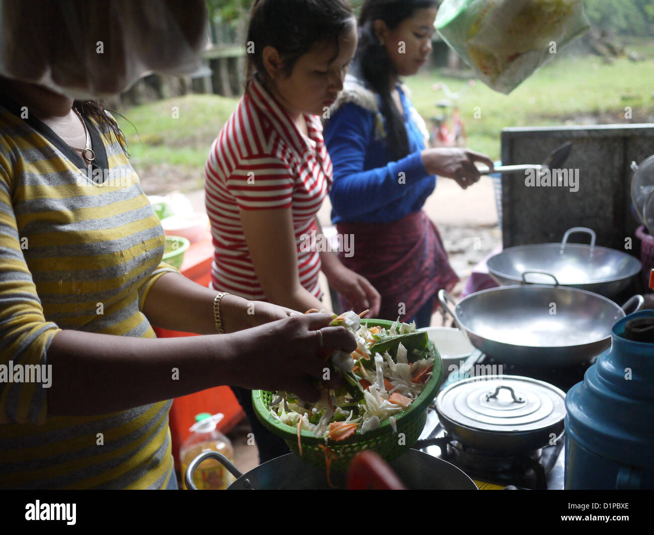 Asian woman cooking kitchen Cambodia Stock Photo - Alamy