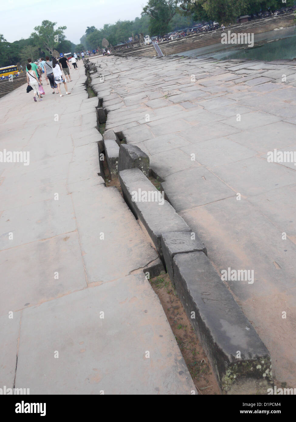 uneven road broken pathway Stock Photo - Alamy