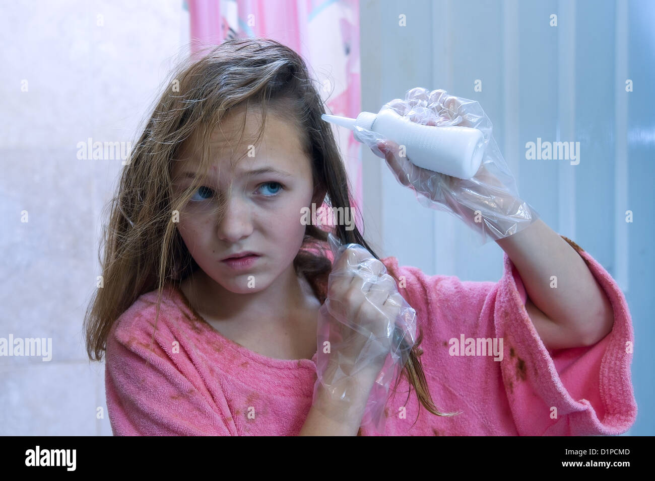 A Young Adolescent Caucasian Girl Dyes Her Hair For The First Time She Is Wearing A Pink