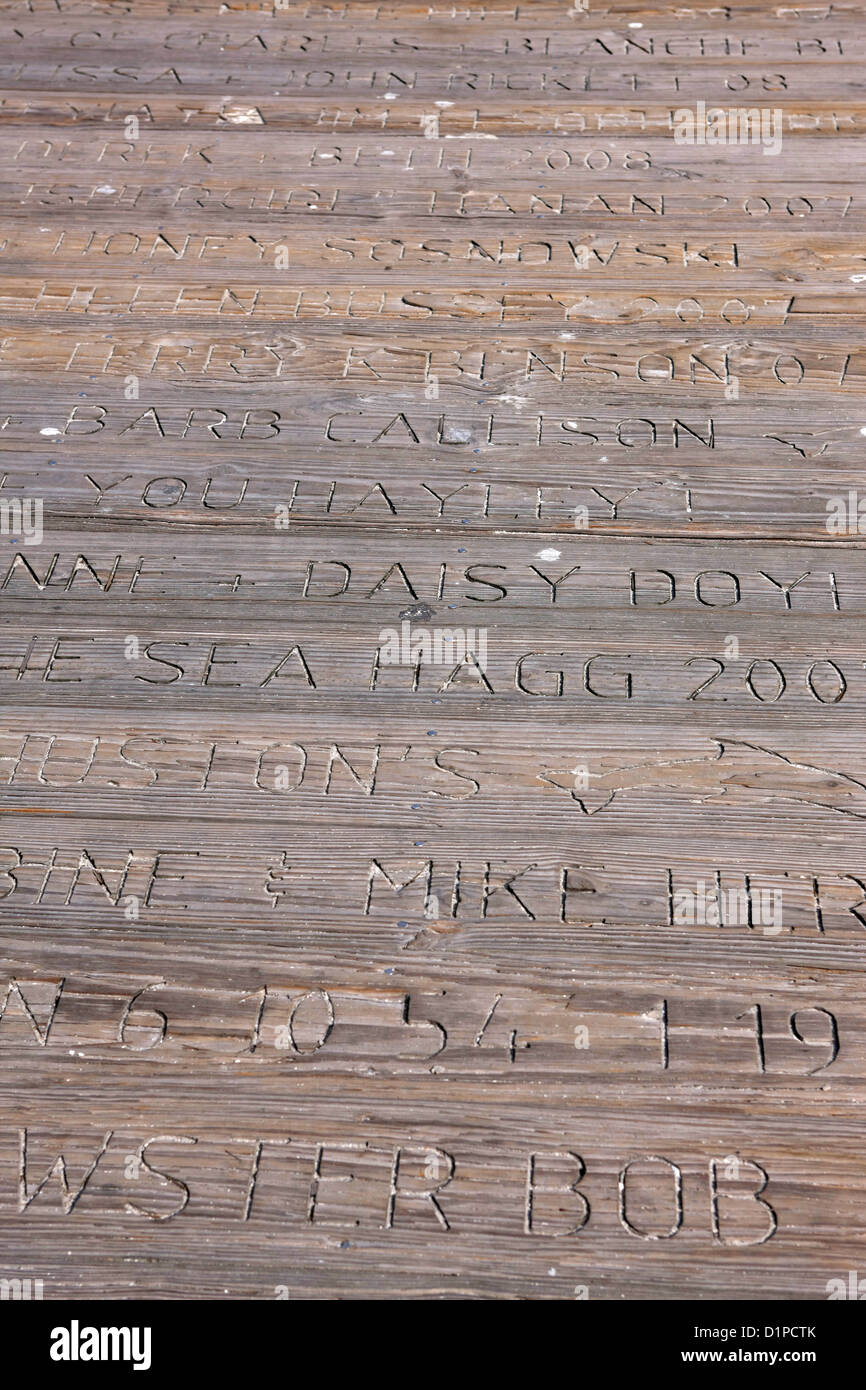 Carved names on the boardwalk of Rod & Reel Pier at Anna Maria Island ...