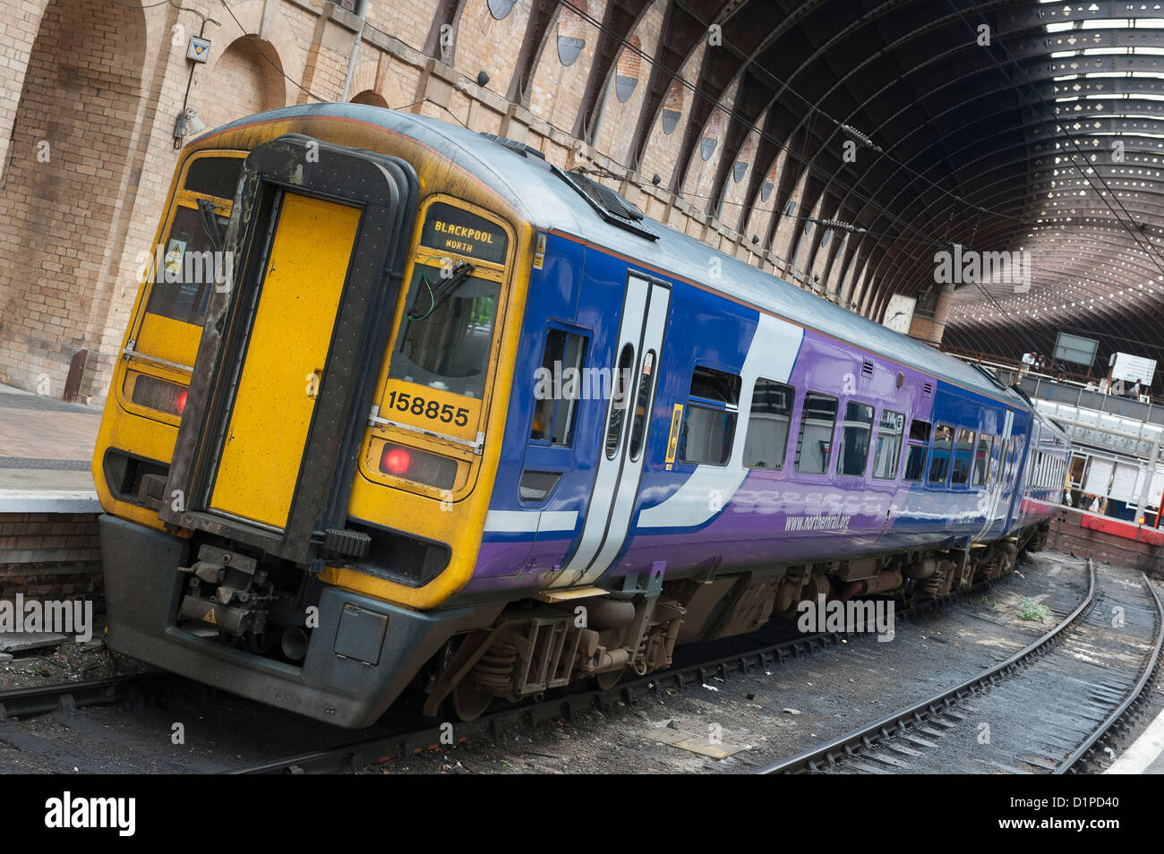 Northern Rail Class 158 passenger train waiting at a platform at York ...