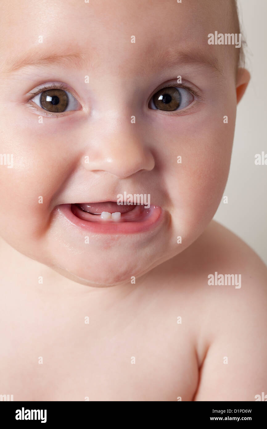 baby girl with two teeth Stock Photo - Alamy