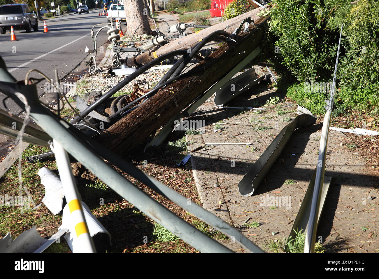 downed power poles and other debris on a suburban sidewalk Stock Photo ...