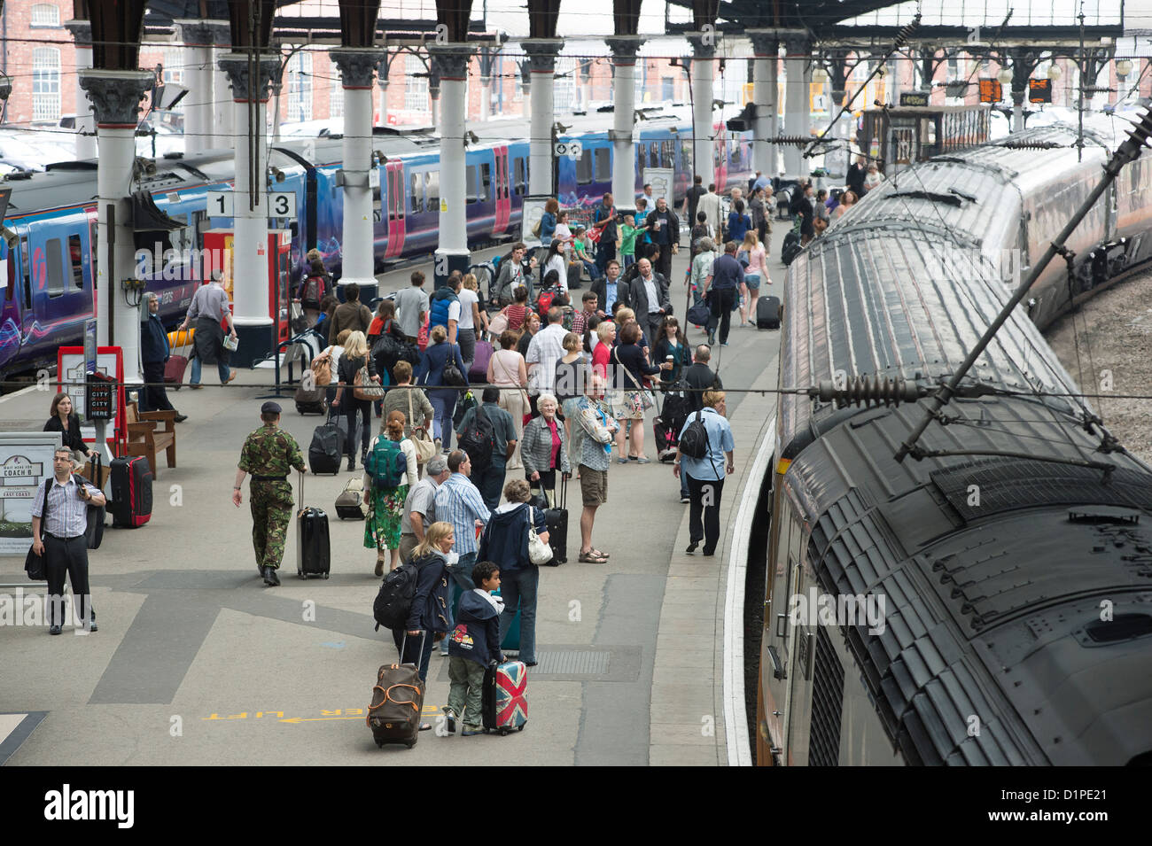 People waiting to board a Grand Central train at York Railway Station ...