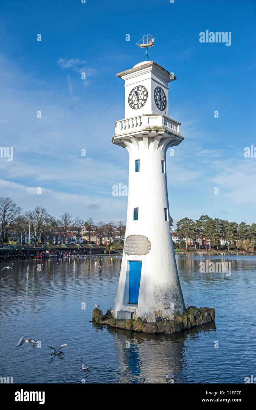 The Scott Memorial Clock Tower lighthouse on Roath Park Lake in Cardiff ...