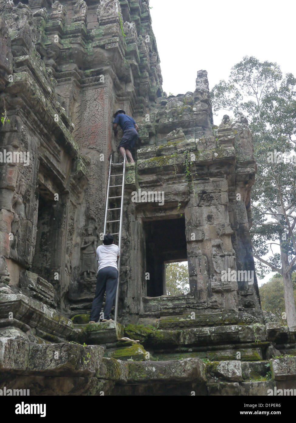 working climb ladder reach roof temple Stock Photo - Alamy