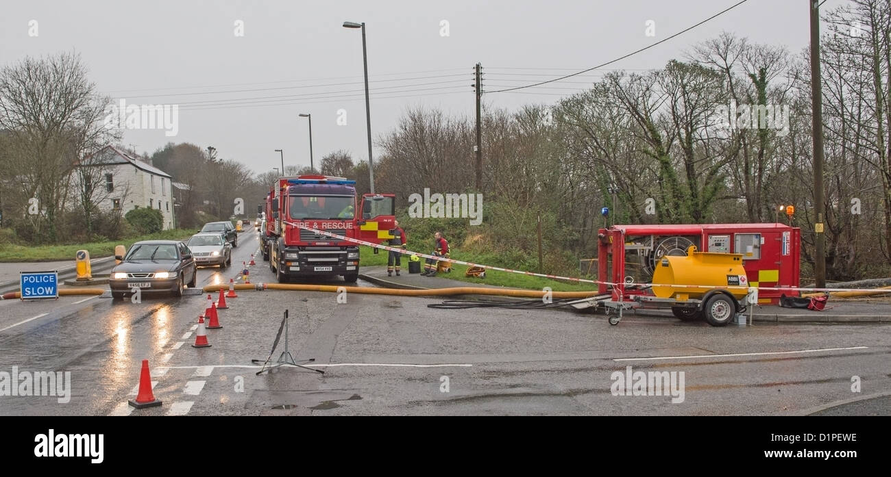 Emergency Fire service, set up pumps and closes off flooded area of ...