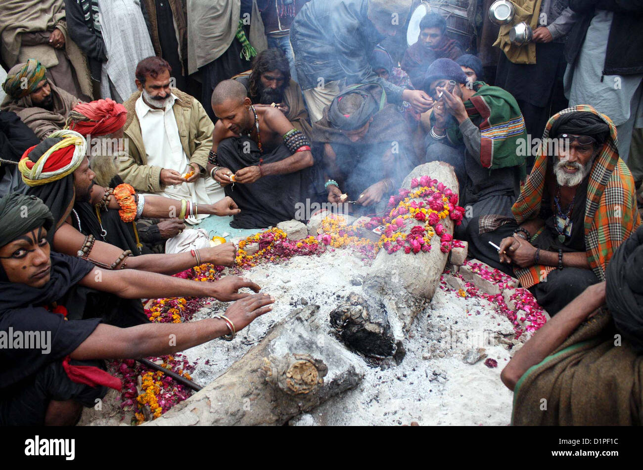 Devotees smokes hashish in sulfi at the shrine of Data Ganj Bakhsh on ...