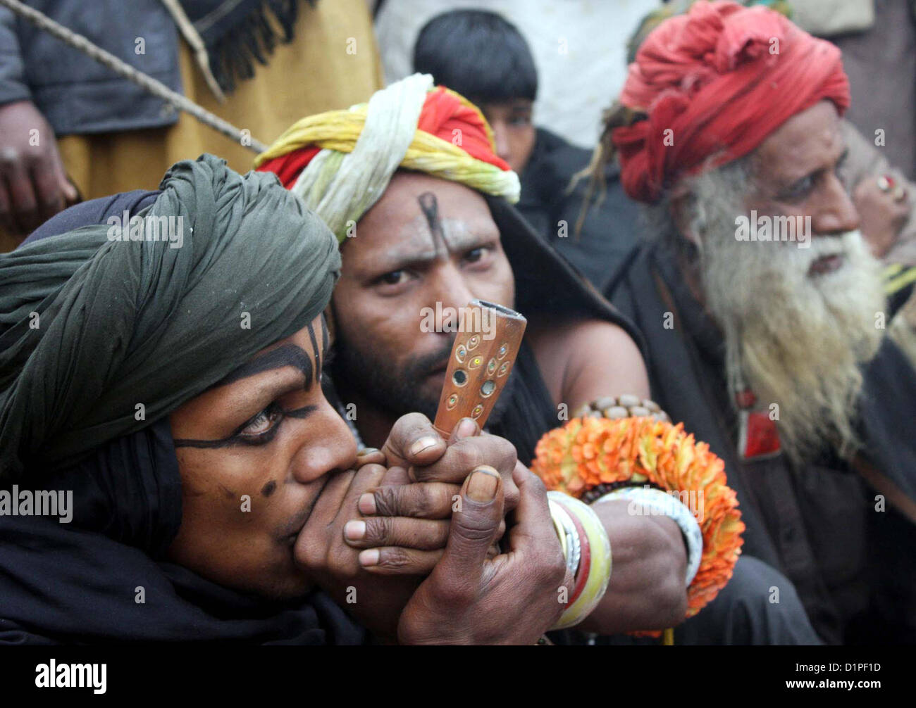 Devotees smokes hashish in sulfi at the shrine of Data Ganj Bakhsh on ...
