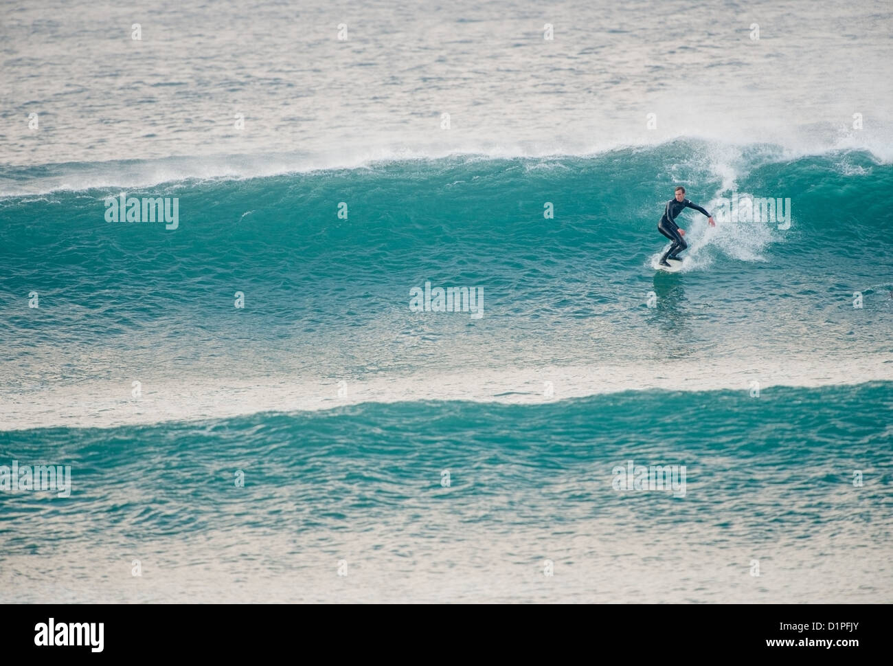 Surfing clean waves at Godrevy Cornwall Stock Photo - Alamy