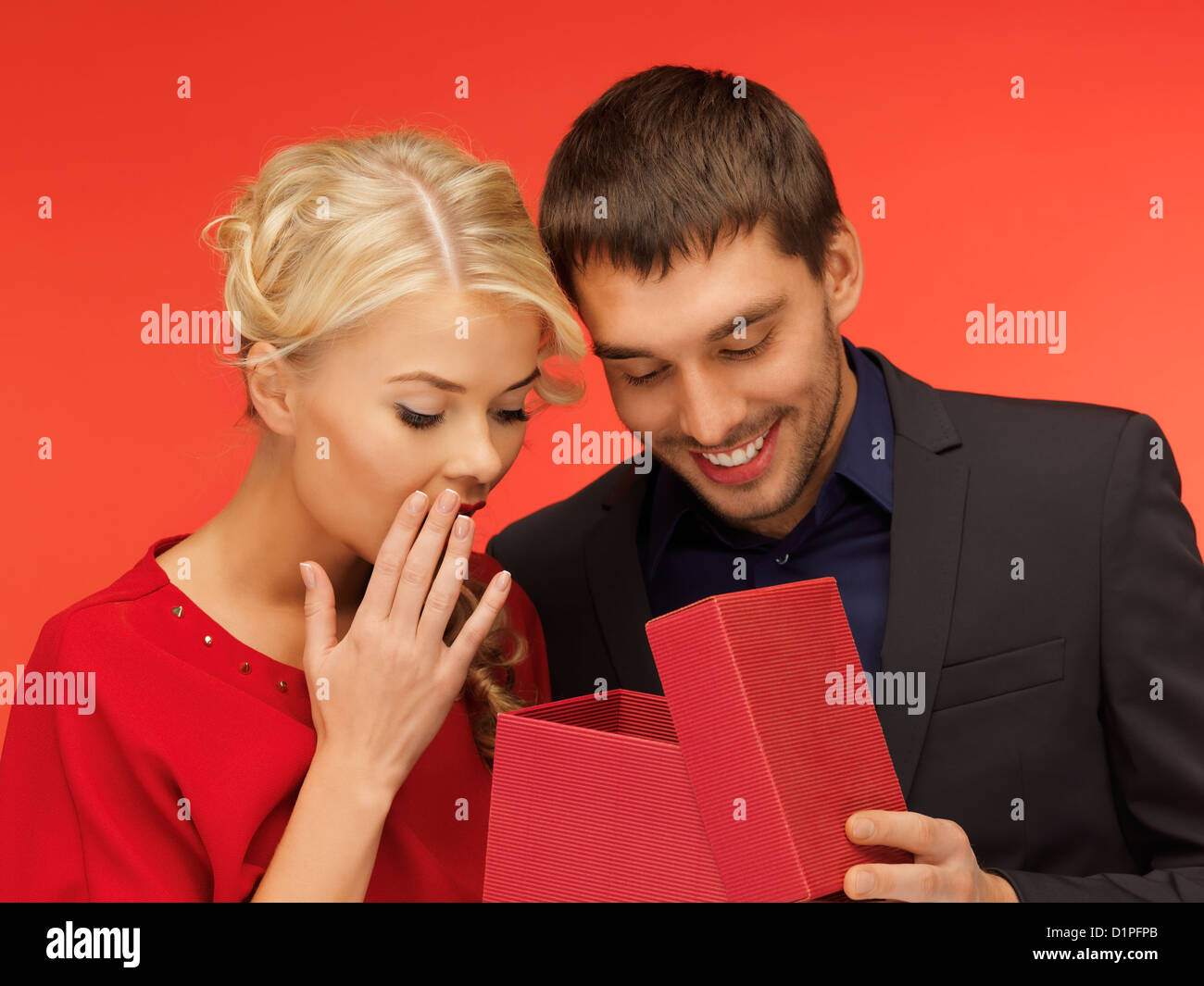 man and woman looking inside the gift box Stock Photo - Alamy