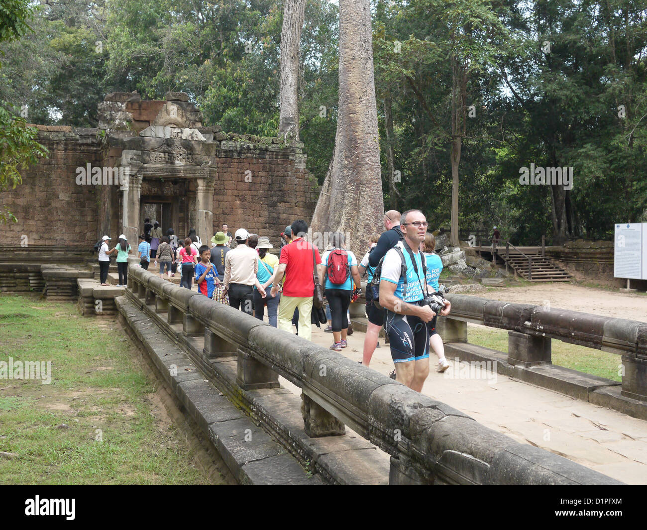 tour group tourists entering temple Stock Photo - Alamy