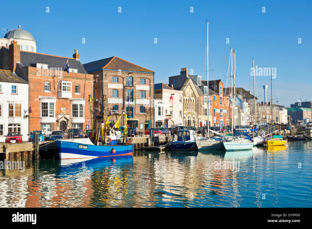 Fishing boats, trawlers and yachts moored at Custom House Quay Weymouth ...