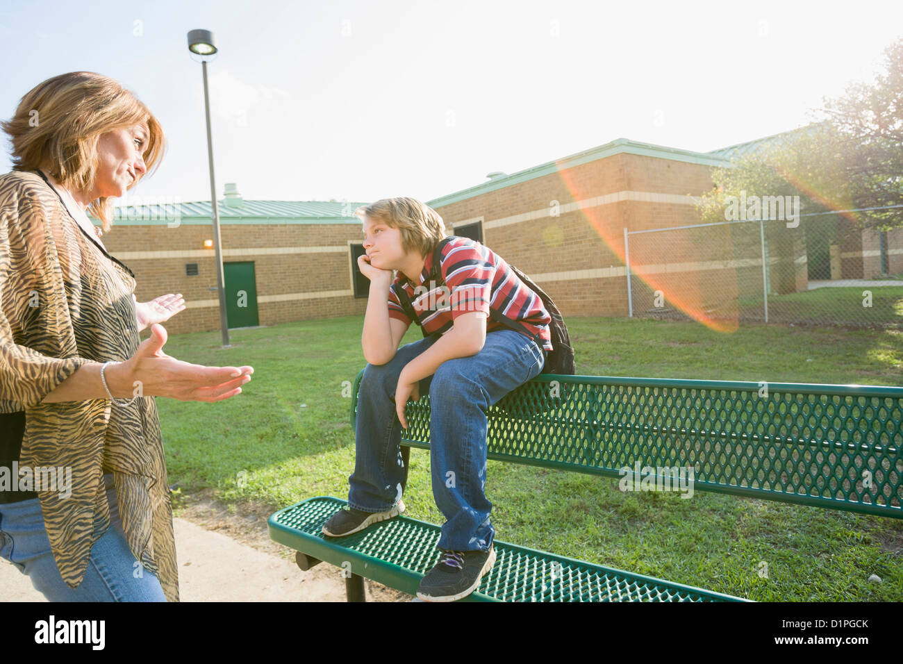 Caucasian mother lecturing son Stock Photo - Alamy