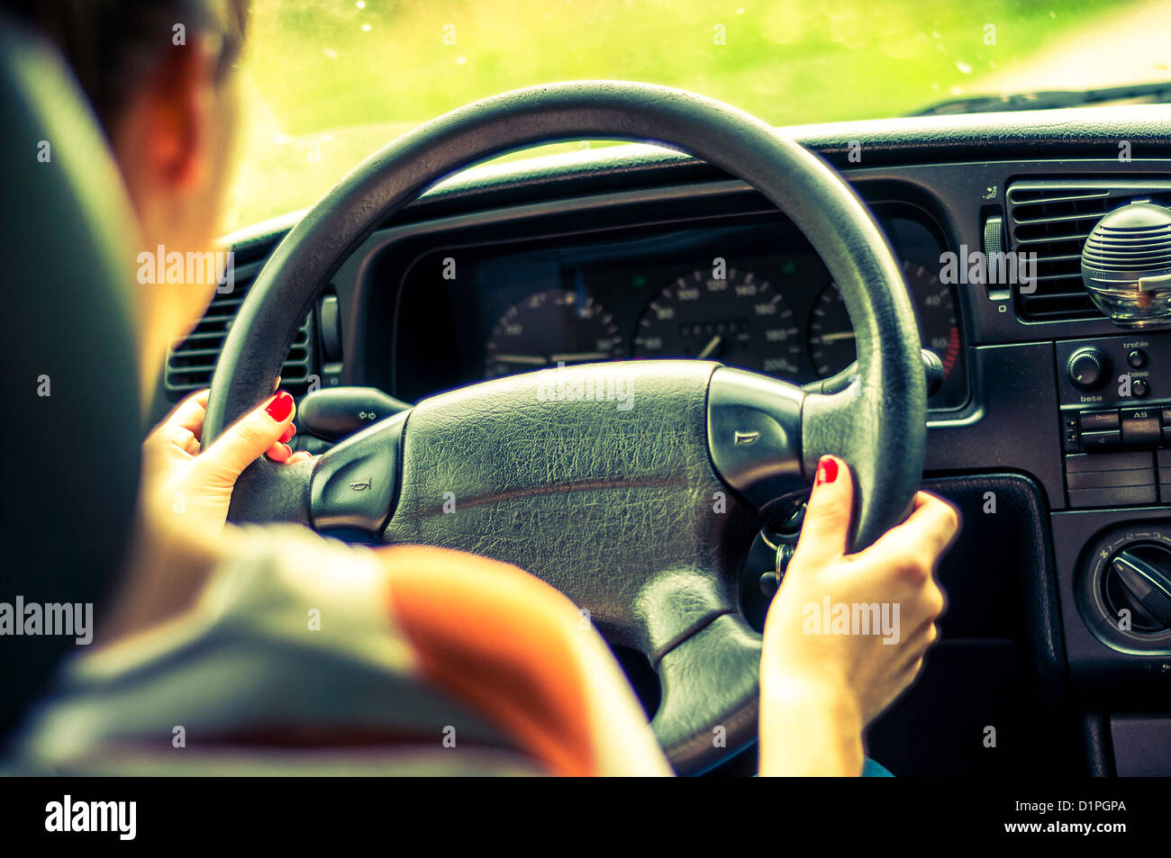 Hands of a female driver on steering wheel Stock Photo - Alamy