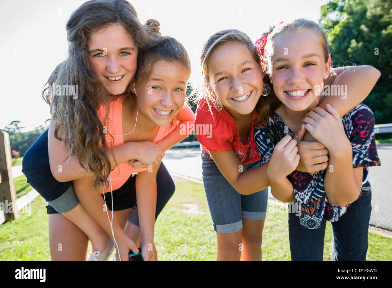Playful girls hanging out together Stock Photo - Alamy