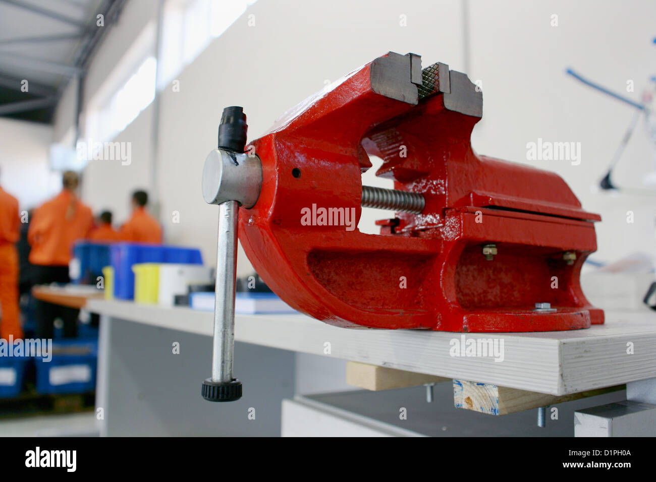 Red clamp tool standing in workshop and it is ready to be used Stock ...
