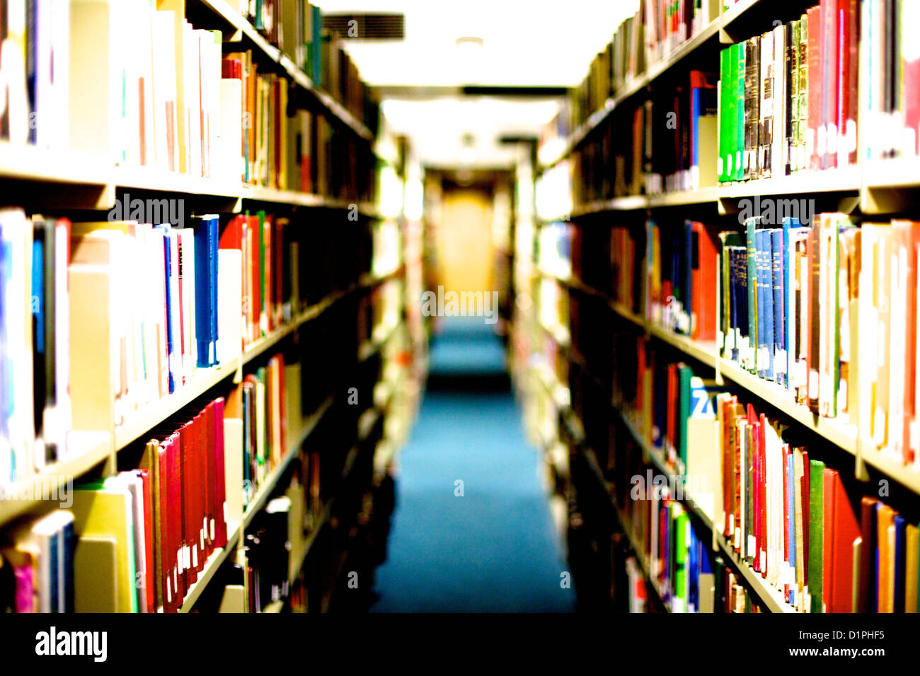 colourful books on library shelves Stock Photo - Alamy