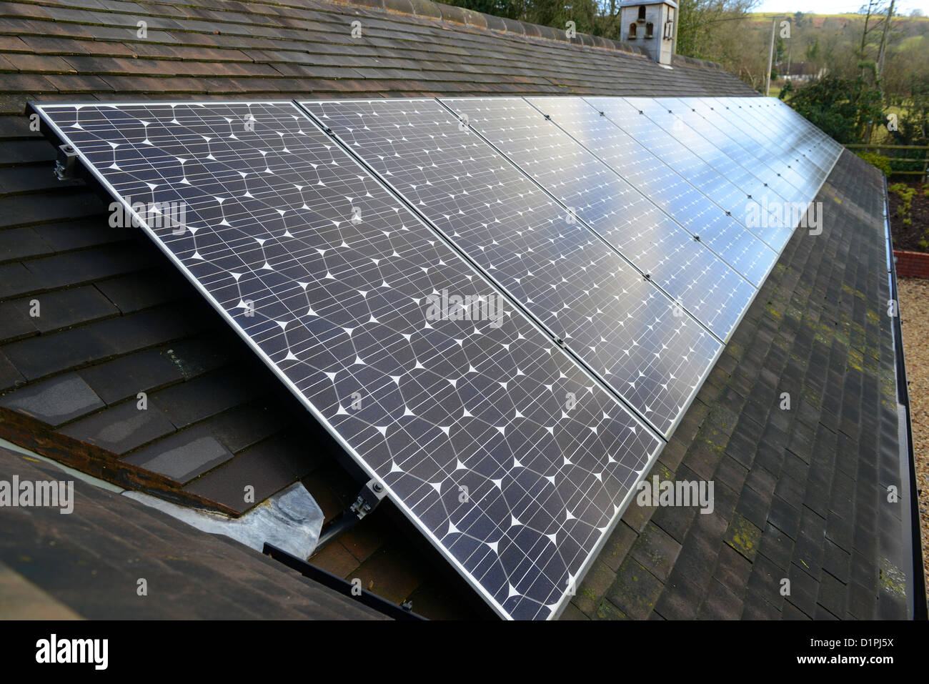 Solar panels on tiled roof Britain Uk Stock Photo - Alamy