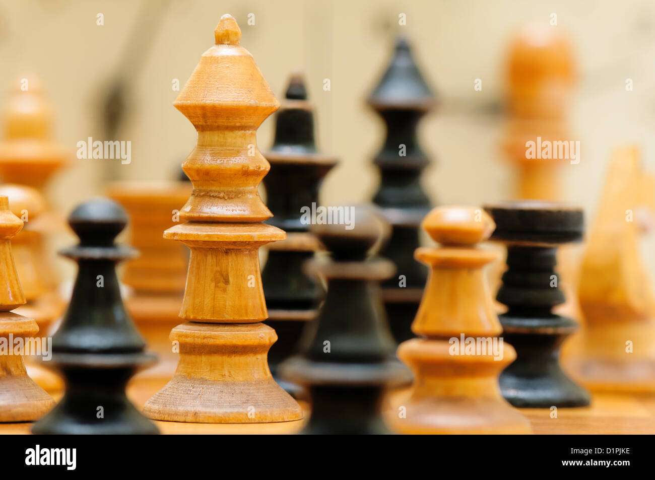 Chess game figures on board with chess timer in background Stock Photo ...