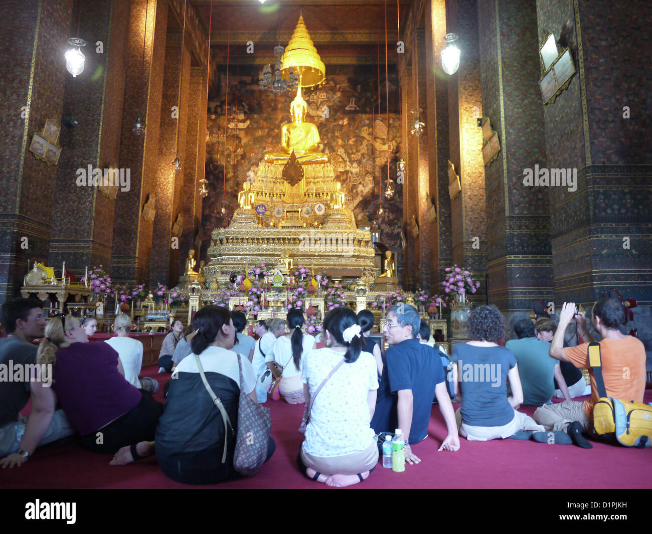 crowd inside Buddhist temple Stock Photo - Alamy
