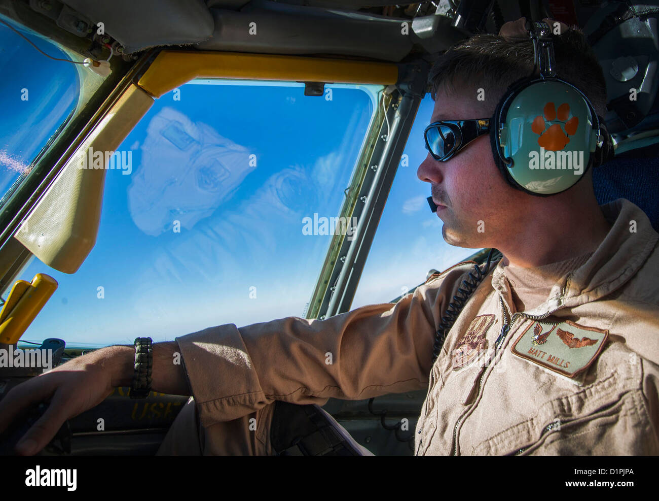 Capt. Matthew Mills, piloting a KC-135 Stratotanker, conducts a ...