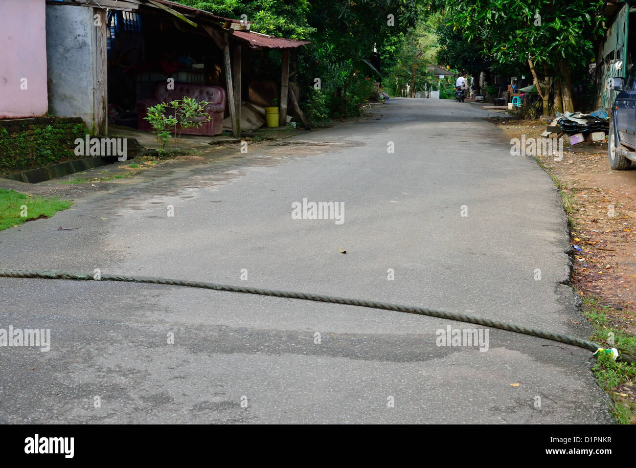 An Indonesian speed bump made out of rope Stock Photo - Alamy