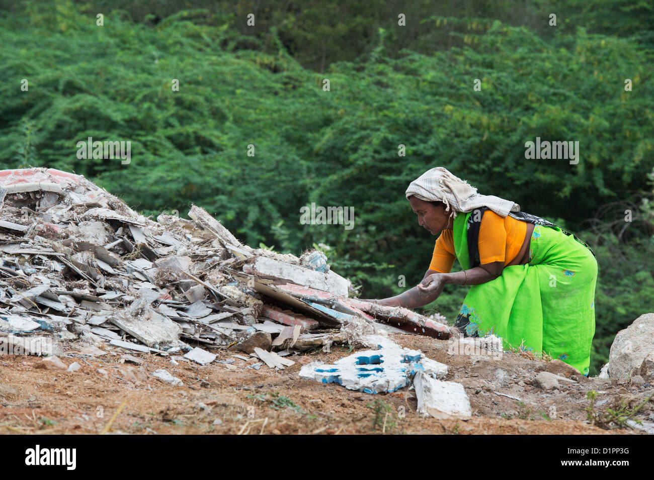 Indian woman picking through rubbish hi-res stock photography and ...