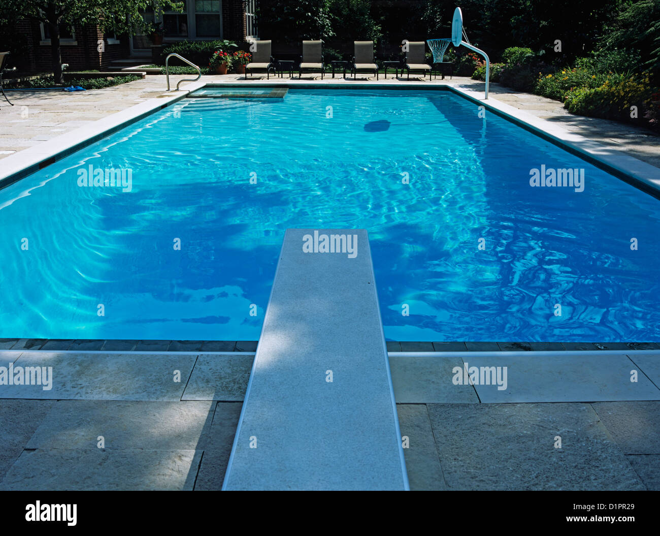 SWIMMING POOLS Straight on view looking from over the diving board ...