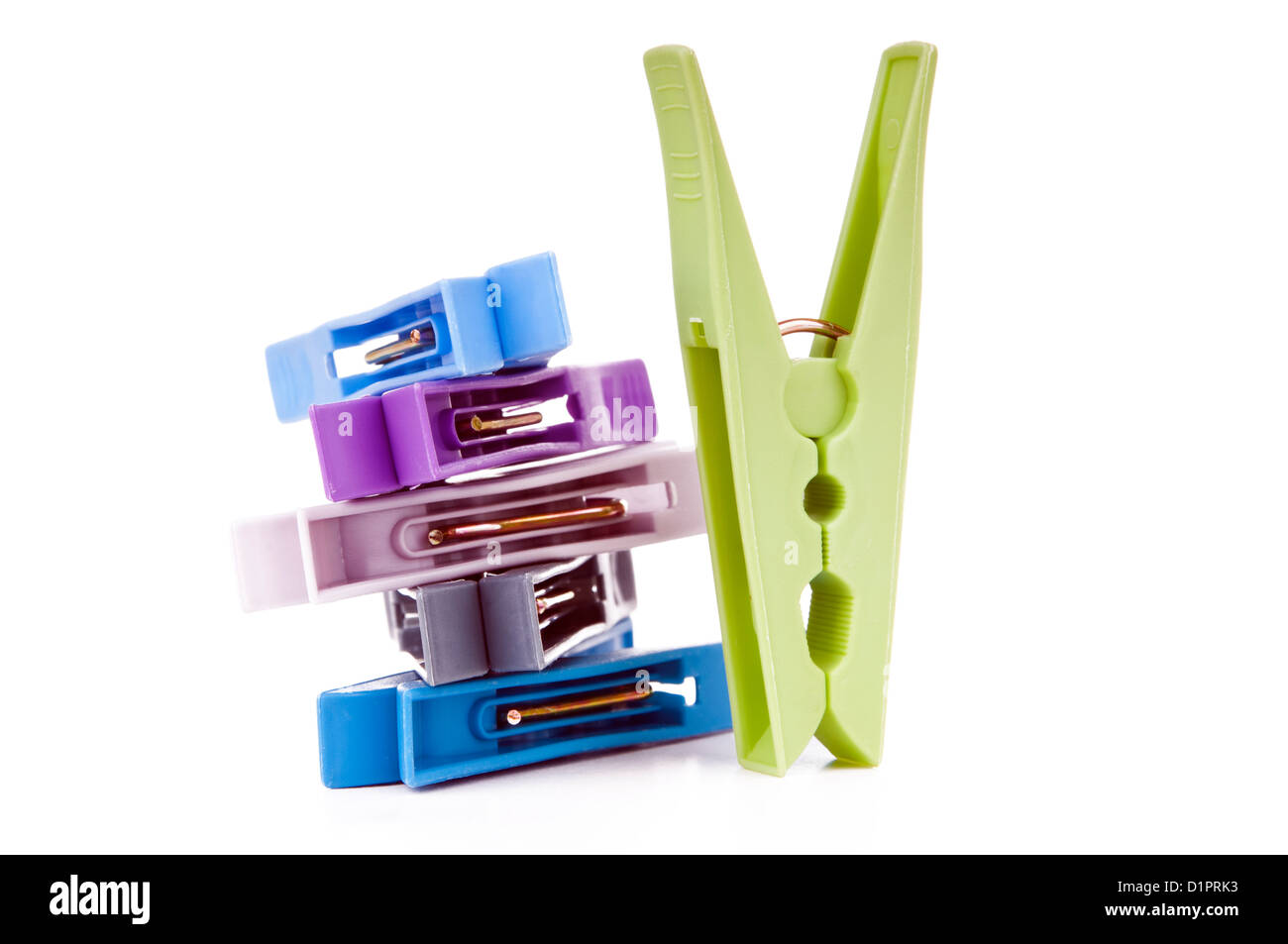 Yellow plastic clothes pegs hi-res stock photography and images - Alamy