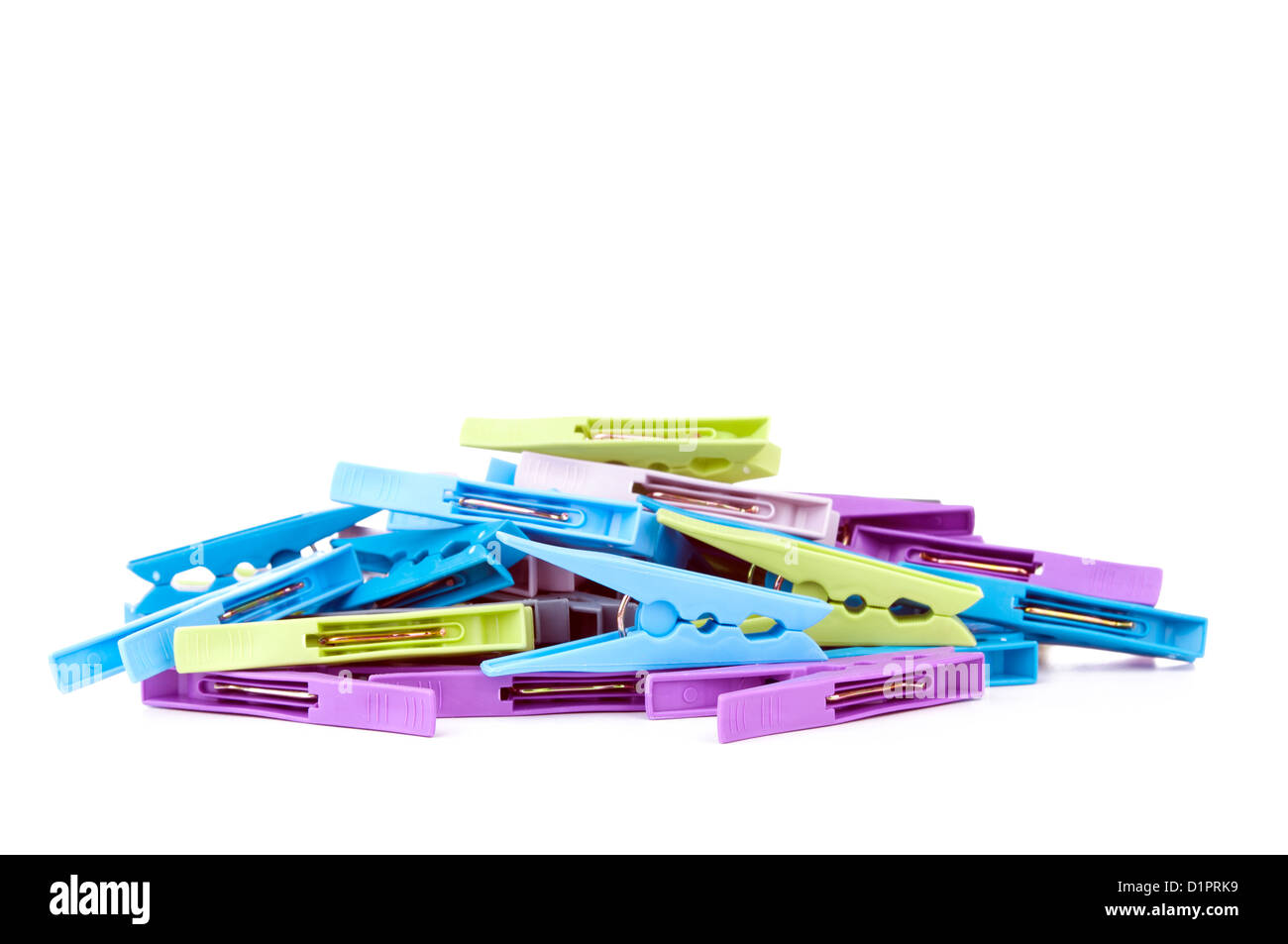 Colorful pegs isolated on white Stock Photo - Alamy
